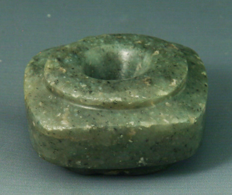 jade cong（A tubular ancient Chinese jade ritual object with a circular ...
